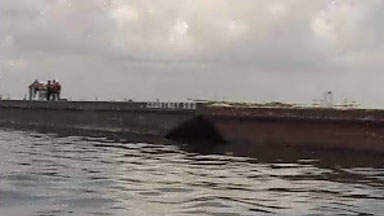 Flotilla of barges used as oil barricade | wwltv.com